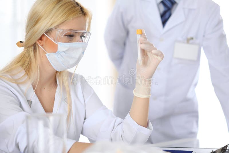 Scientific Research Team with Clear Solution in Laboratory Stock Image ...