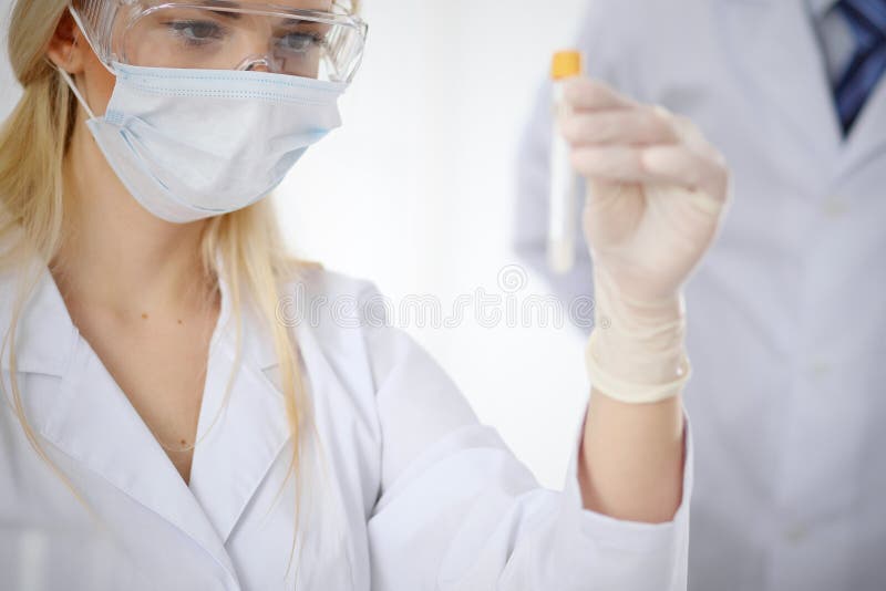 Scientific Research Team with Clear Solution in Laboratory Stock Photo ...