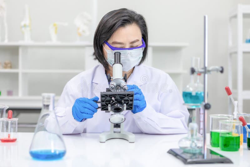 Scientis Using Microscope To Work in Lab Stock Image - Image of ...