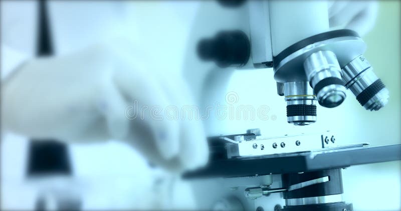 Scientist Adjusting the Microscope in Laboratory Room. Stock Footage ...