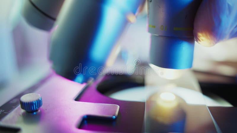 Scientist Adjusting Microscope Lens for Research Stock Footage - Video ...