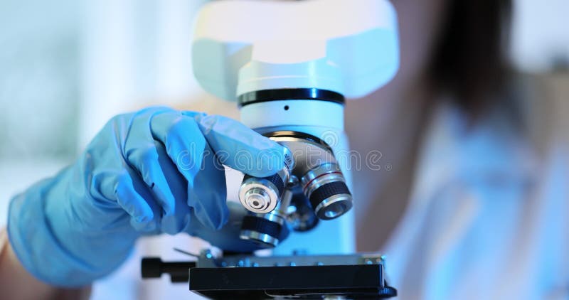 Scientist Adjusts Microscope Lens in Laboratory Setting Stock Footage ...