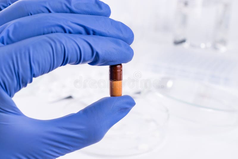 Scientist Analyzing Pills in Medical Laboratory Stock Photo - Image of ...