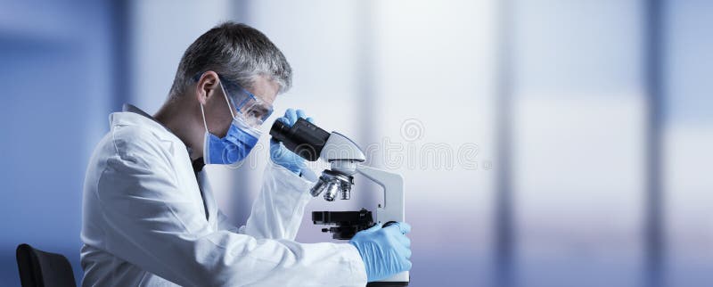 Scientist Analyzing Samples Under the Microscope Stock Image - Image of ...