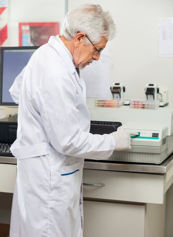 Scientist Analyzing Samples Using Analyzer Stock Image - Image of ...