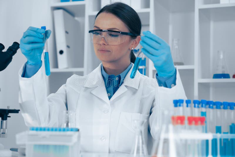 Scientist Analyzing Test Tubes in a Laboratory Setting Stock Image ...