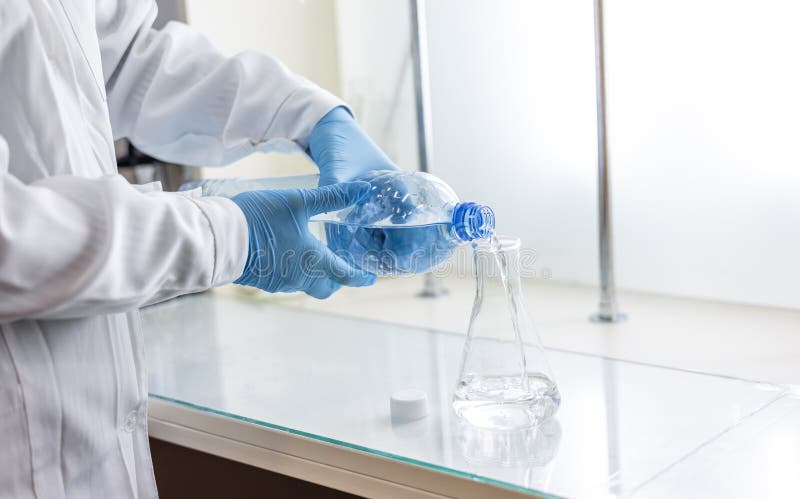 Scientist is Analyzing and Testing a Water Concept. Lab Assistant ...