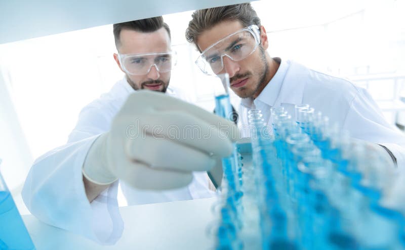 Scientist and Assistant Studying the Solution in the Tube Stock Image ...