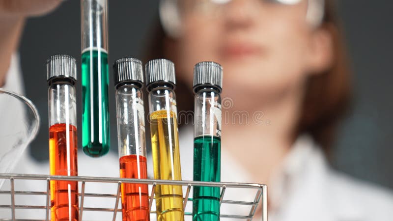 Scientist Bring Colored Solution or Chemical Liquid Doing Experiment ...