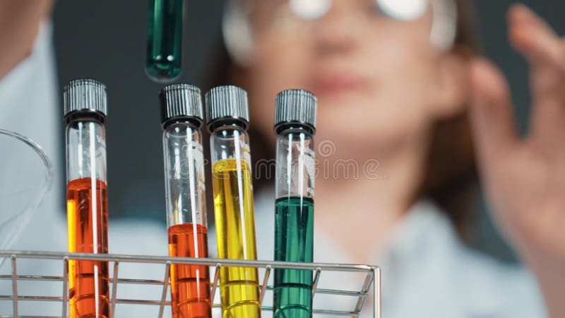 Scientist Bring Colored Solution or Chemical Liquid Doing Experiment ...