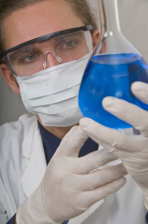 Scientist with chemicals stock image. Image of biochemistry - 13950875