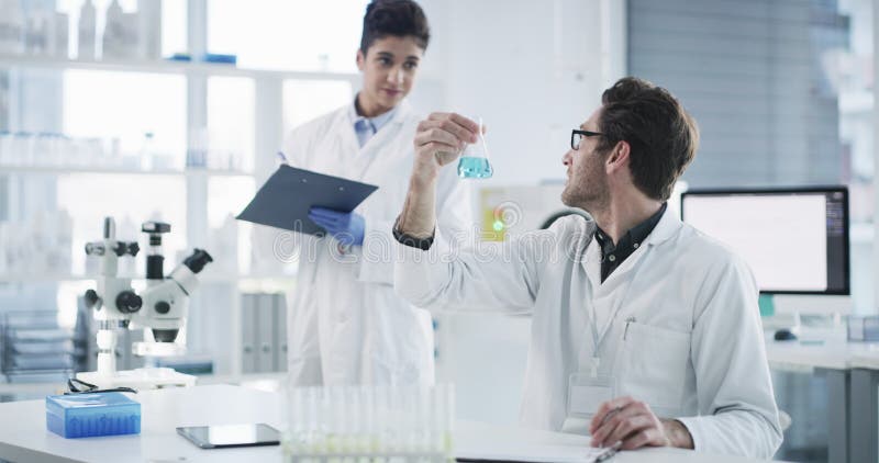 Scientist, Chemicals and Experiment Writing Notes in Lab for Research ...