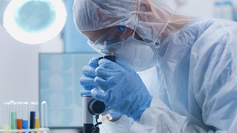 Scientist Chemist Looking into Medical Microscope Analyzing Dna Sample ...