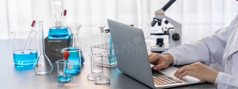 Scientist Conduct Chemical Experiments in Laboratory with Laptop ...