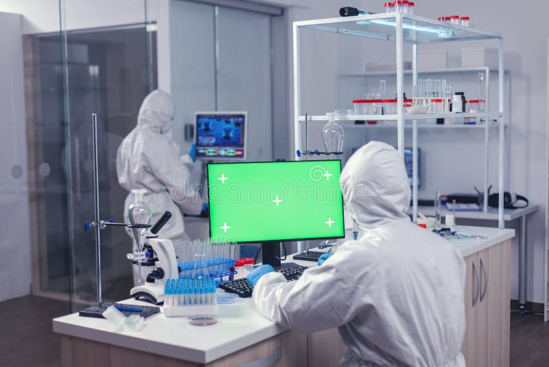 Scientist Conducting Experiment Using Computer with Green Screen Stock ...