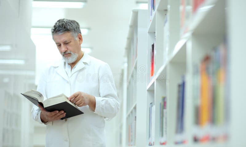 Scientist/doctor in a Library Stock Photo - Image of confident, person ...