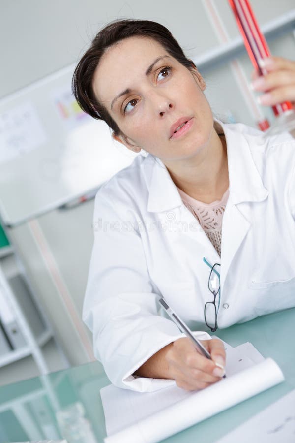 Scientist Documenting Observation on Liquid Stock Photo - Image of ...