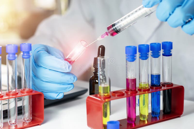 Scientist Doing Chemical Experiment in Laboratory with Flask of Liquid ...