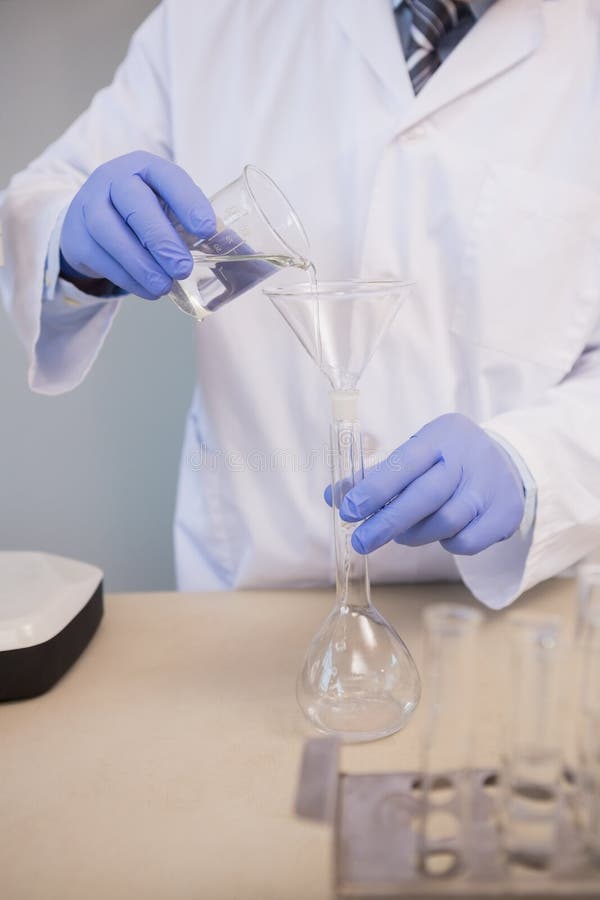 Scientist Doing Experimentations in Flask Stock Photo - Image of liquid ...