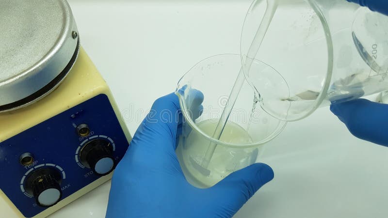 Scientist Doing an Investigation through a Beaker in the Laboratory ...