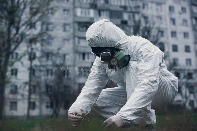Scientist Doing Research Outdoors, Wearing White Coverall and Gas Mask ...