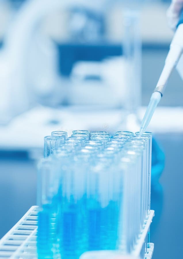 Scientist Dropping the Reagent into Test Tube for Reaction Testing ...