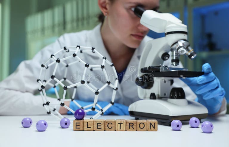 A Scientist Engaged in Observing Electron Microscopy while Utilizing a ...