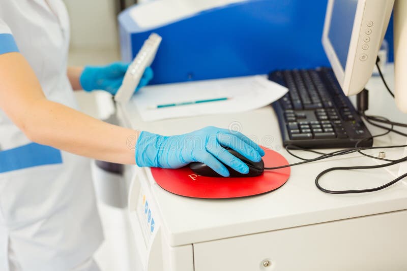 Scientist Entering Data of Blood Sample in Computer at Laboratory Stock ...