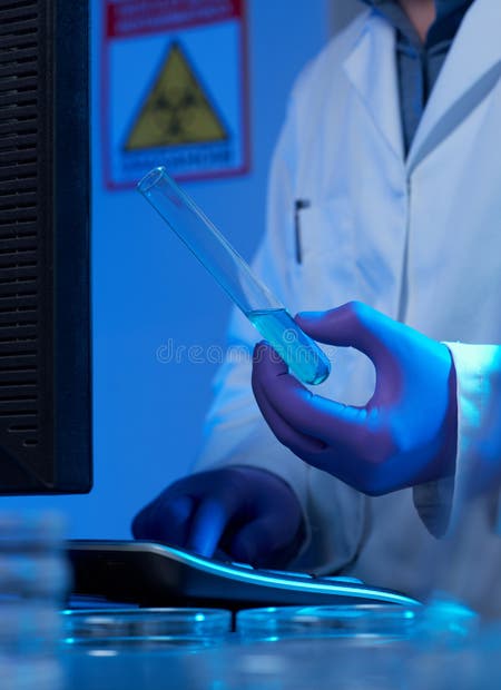 Scientist Entering Data into Computer Stock Photo - Image of blue, hand ...