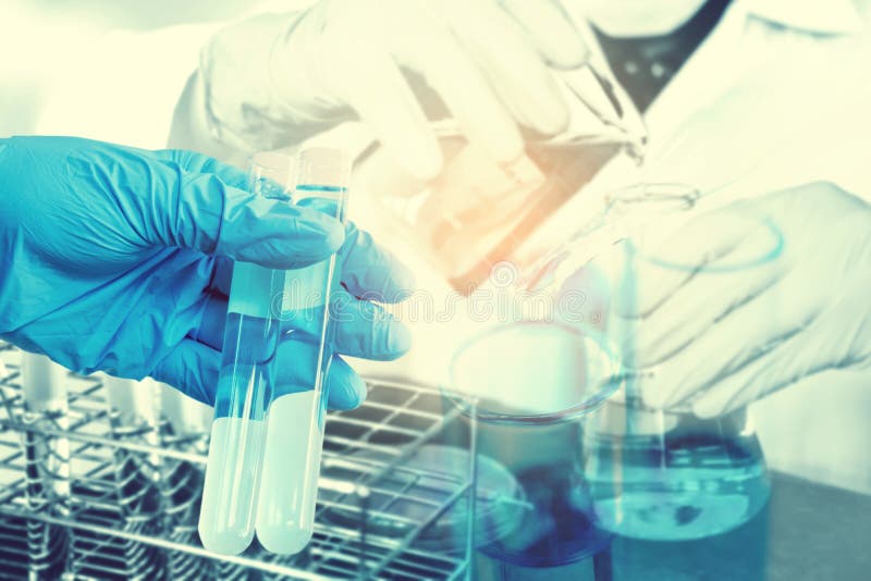 Scientist with Equipment Holding Tools during Scientific Experiment ...