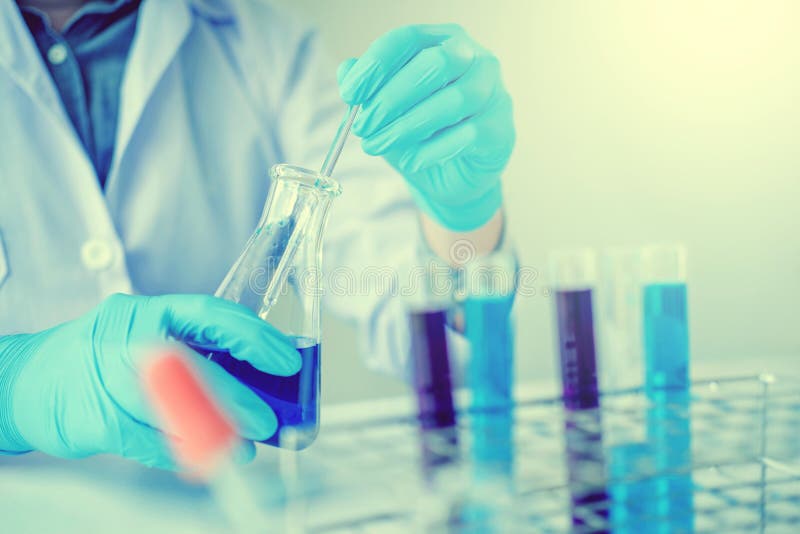 Scientist with Equipment Holding Tools during Scientific Experiment ...