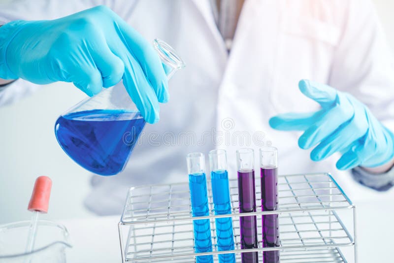 Scientist with Equipment Holding Tools during Scientific Experiment ...