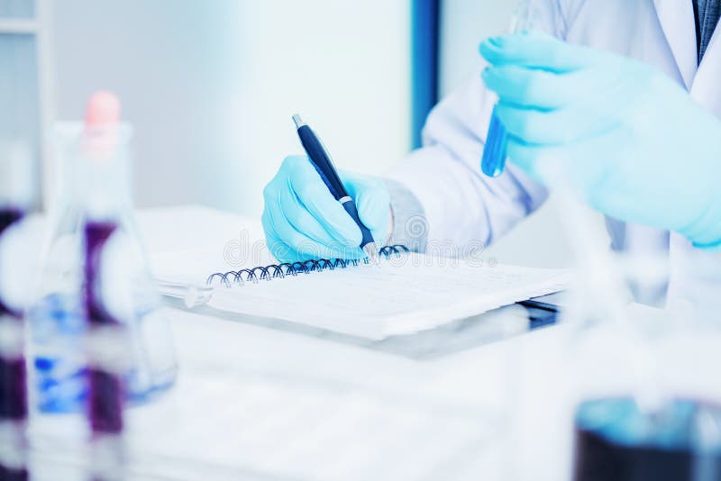 Scientist with Equipment Holding Tools during Scientific Experiment ...