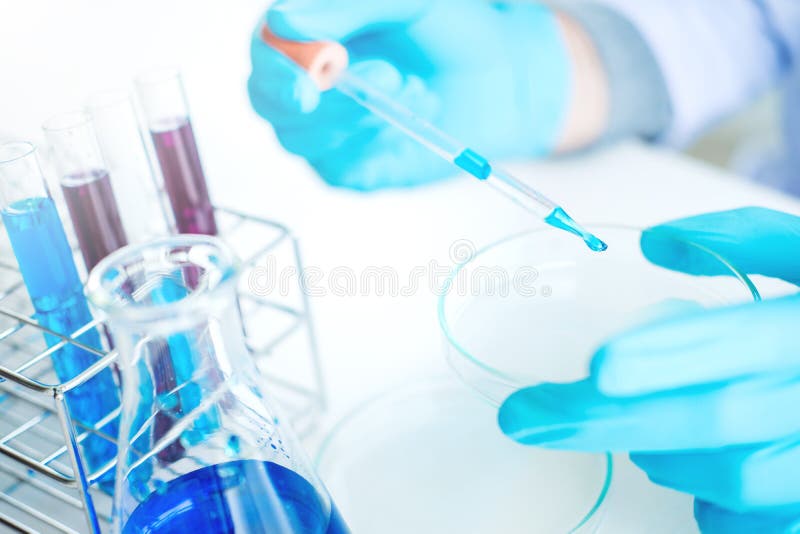 Scientist with Equipment Holding Tools during Scientific Experiment ...