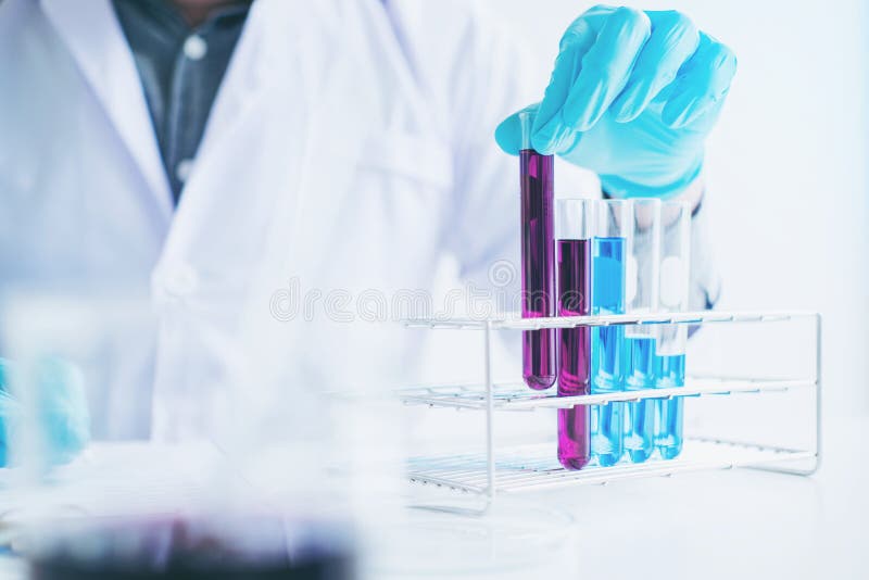 Scientist with Equipment Holding Tools during Scientific Experiment ...