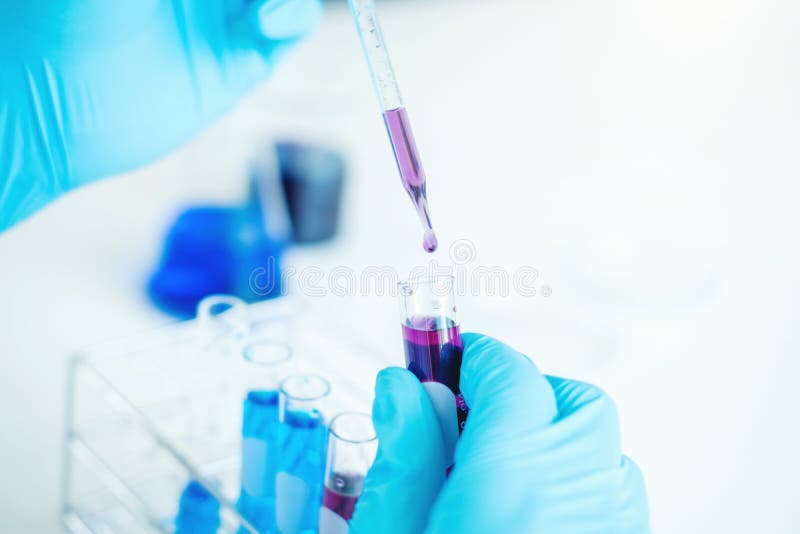 Scientist with Equipment Holding Tools during Scientific Experiment ...