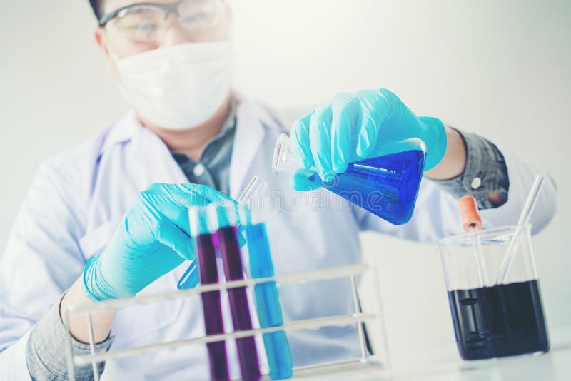 Scientist with Equipment Holding Tools during Scientific Experiment ...