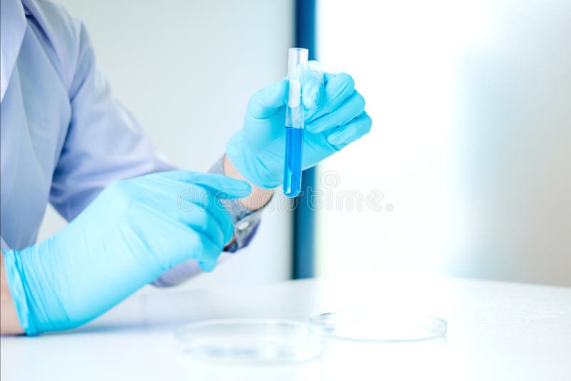 Scientist with Equipment Holding Tools during Scientific Experiment ...