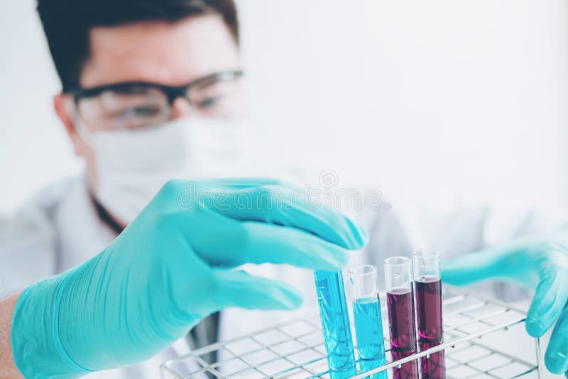 Scientist with Equipment Holding Tools during Scientific Experiment ...