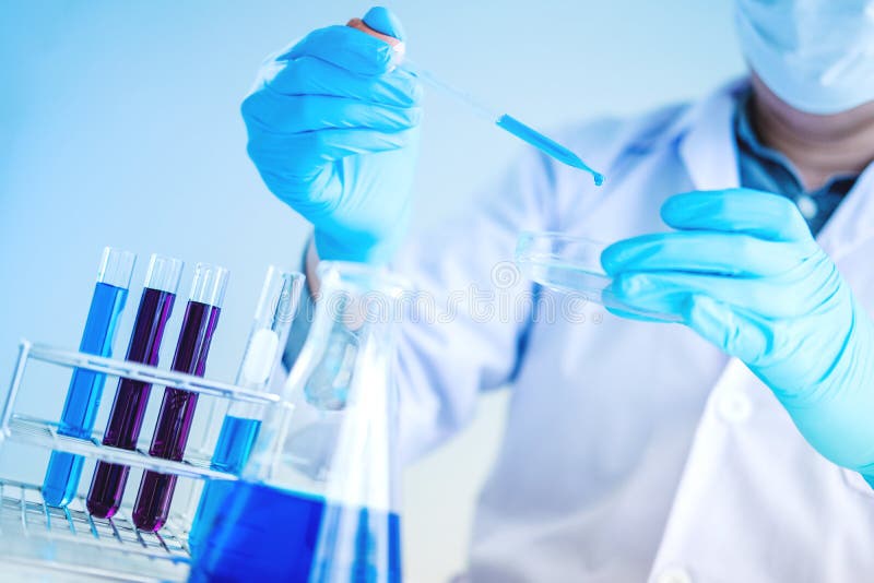 Scientist with Equipment Holding Tools during Scientific Experiment ...