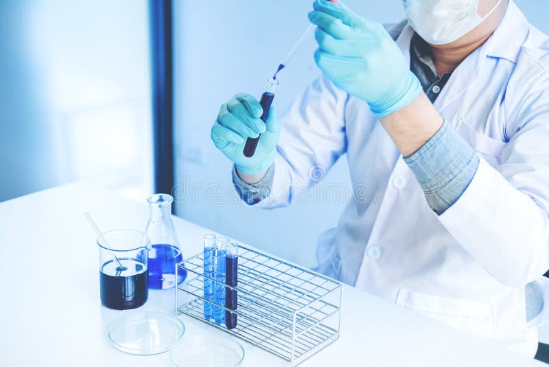 Scientist with Equipment Holding Tools during Scientific Experiment ...