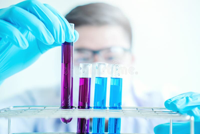 Scientist with Equipment Holding Tools during Scientific Experiment ...