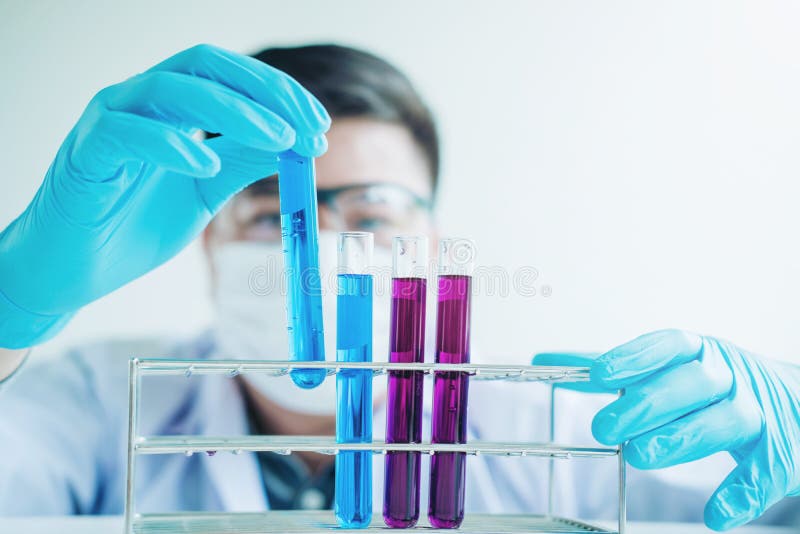 Scientist with Equipment Holding Tools during Scientific Experiment ...