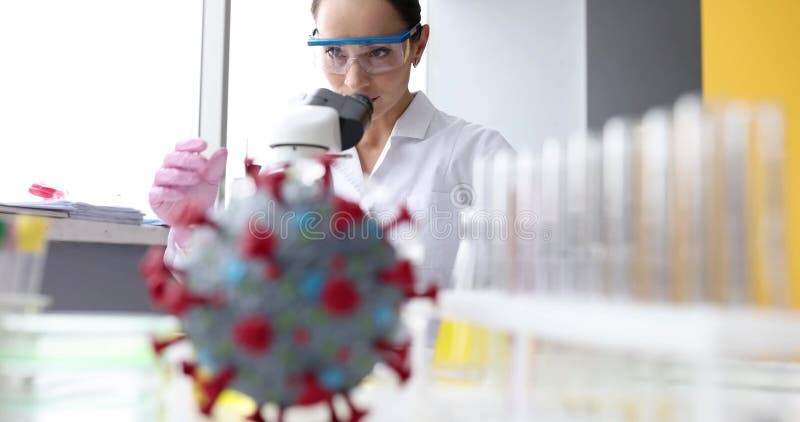 Scientist Examines Bacteria and Virus on Microscope in Laboratory Stock ...