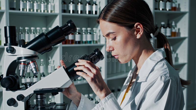 Scientist Examines Samples Under Microscope in a Modern Laboratory ...