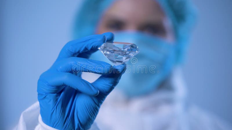 Scientist Examining Graph Curves, Conducting Medical Research ...