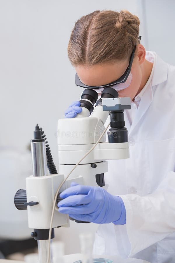 Scientist Examining Something with the Microscope Stock Image - Image ...