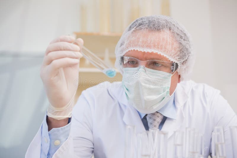 Scientist examining tube stock image. Image of scientific - 53082779
