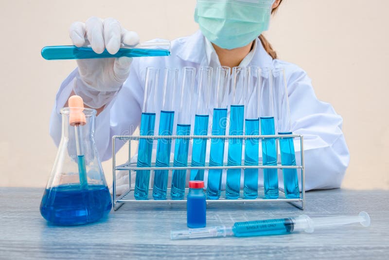 The Scientist is Experimenting with the Blue Serum Liquid with ...