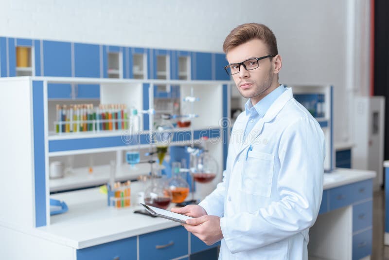 Scientist in Eyeglasses and Lab Coat Holding Digital Tablet Stock Image ...